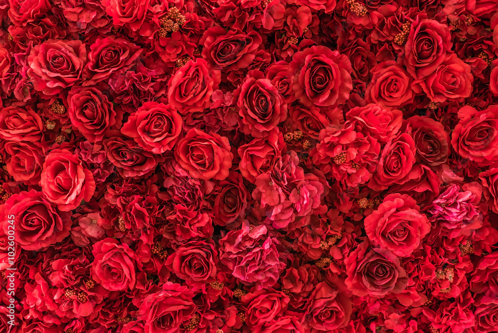 Backdrop of vivid red paper roses background in a wedding reception ...