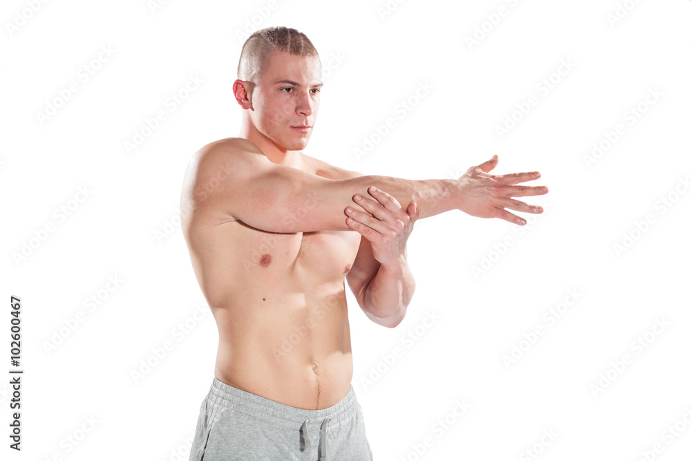 Muscular male bodybuilder stretching arms isolated on white Stock Photo ...