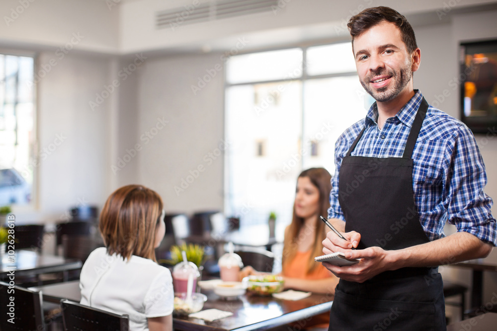 Attractive waiter ready to take your order Stock Photo | Adobe Stock