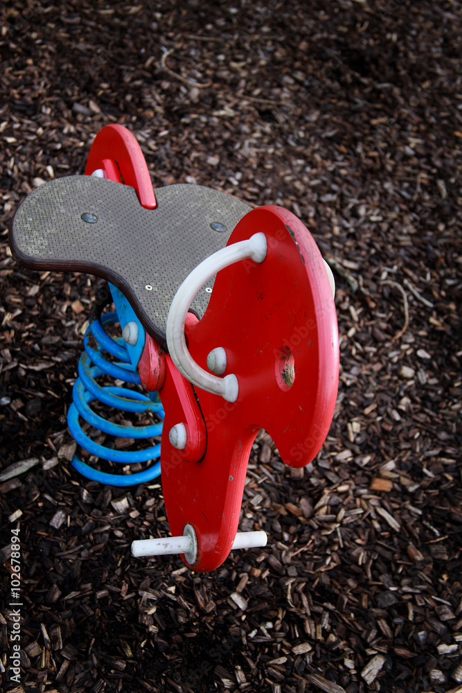 Childrens spring rocking ride in a play park standing empty Stock Photo ...