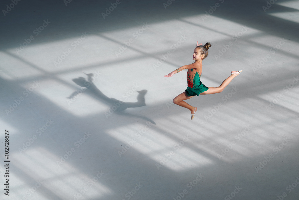 girl jumping gymnast trains in sports school Stock Photo | Adobe Stock