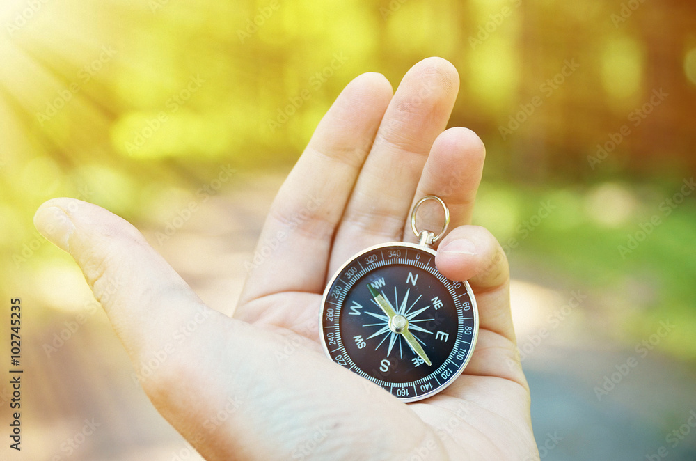 Compass in the hand foto de Stock | Adobe Stock