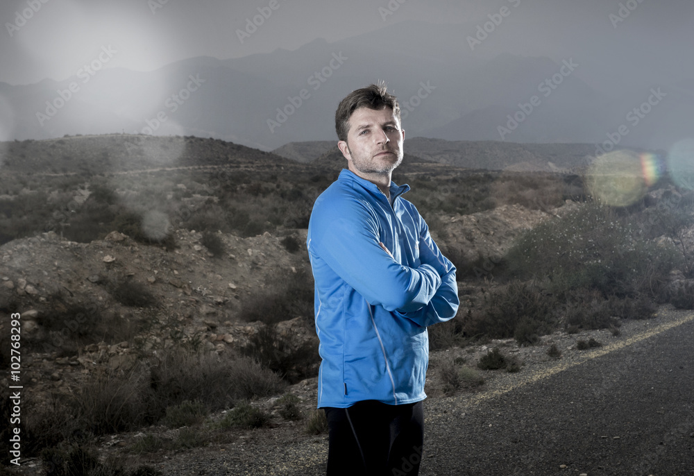 attractive sport man with folded arms posing cool and defiant attitude ...