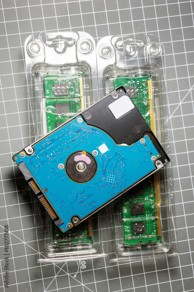 2,5 HDD hard disk drive on two RAM Random-access memory sticks in ...