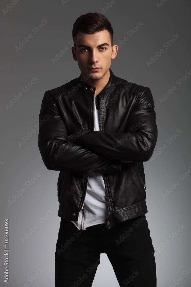 man in leather jacket pose standing with hands crossed Stock Photo ...