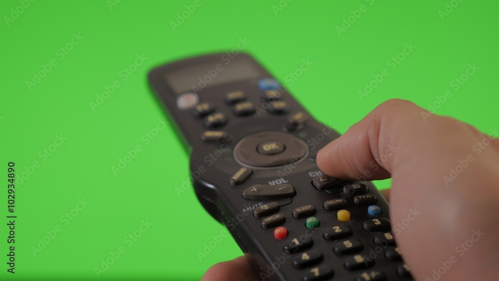 Channel changing with remote on green screen chroma background 4K 2160p ...
