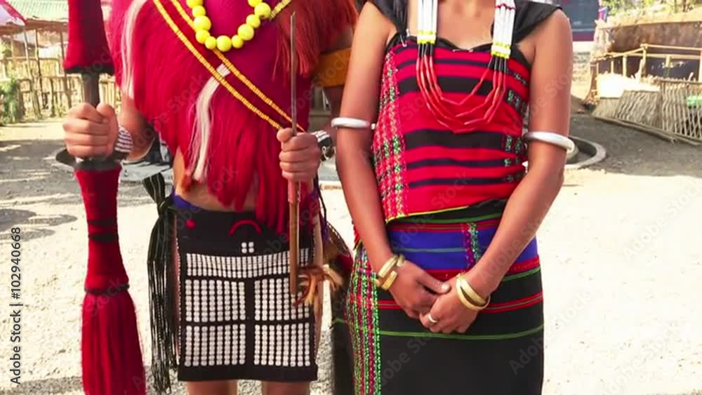 Tilt up shot of a Naga tribes couple in traditional outfit during ...
