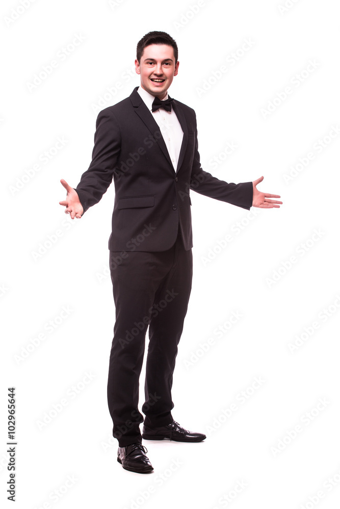 Cheerful young man in suit welcome sign and smiling while standing ...