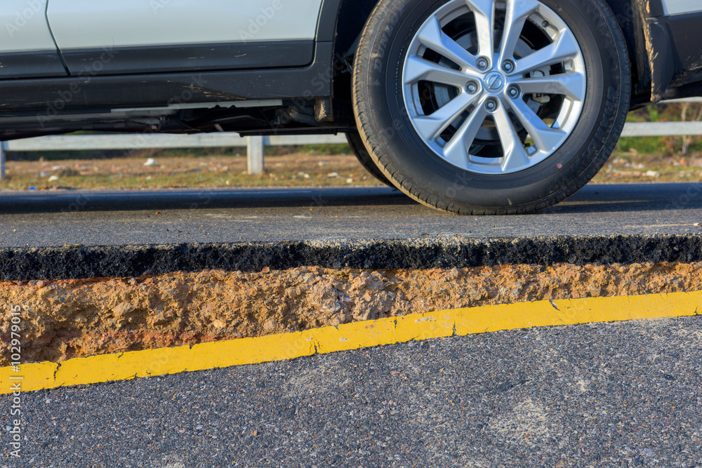 Damaged roads due to Car running. Stock Photo | Adobe Stock