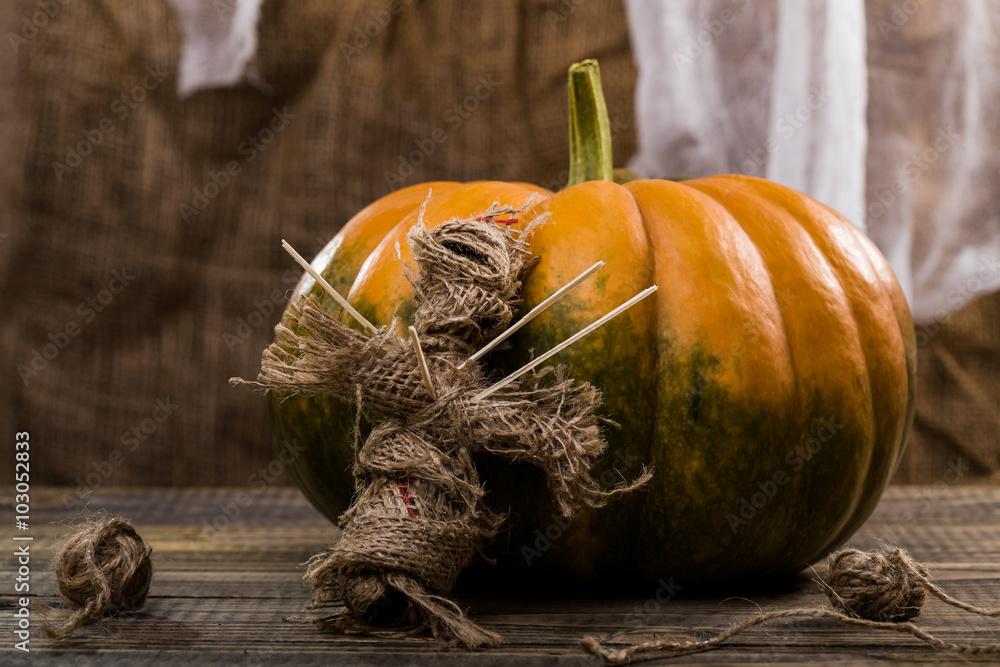 Rag voodoo doll near pumpkin Stock Photo | Adobe Stock