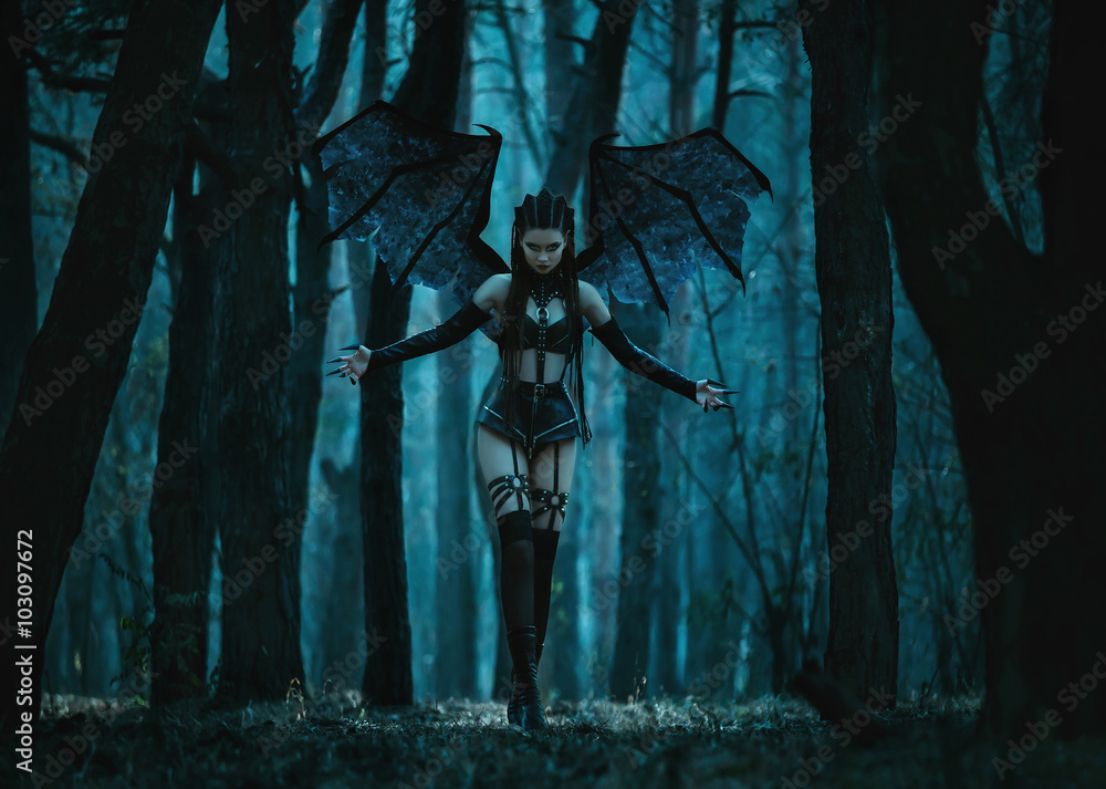 Girl vampire demon with bat wings, woman fantasy succubus walks in dark ...