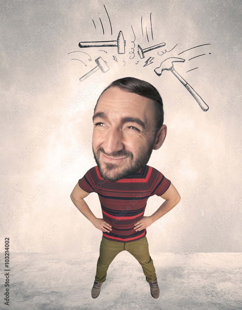 Big head person with drawn hammers Stock Photo | Adobe Stock