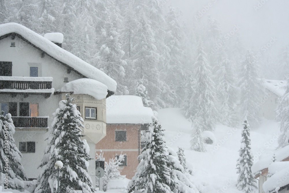 Heavy Snowfall in the mountains village Surlej in Engadin Valley in ...