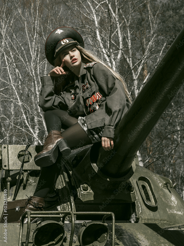 beautiful girl in military uniform with military equipment Stock Photo ...