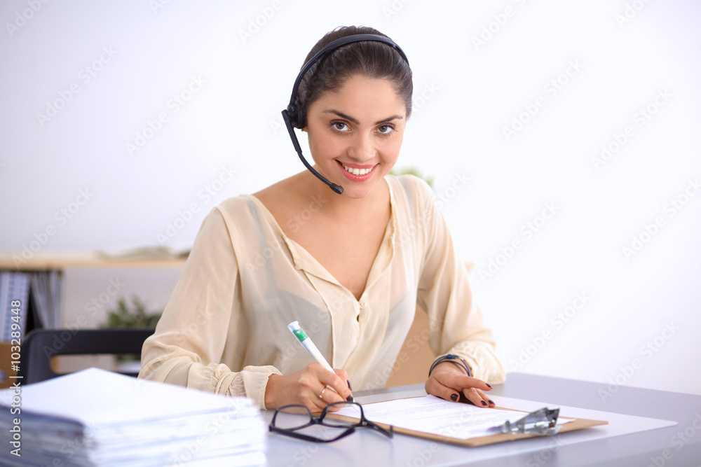 Close-up portrait of a customer service agent sitting at office Stock ...
