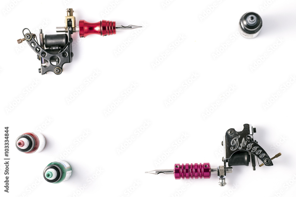 Tattoo machines and three bottles of ink isolated on white background ...