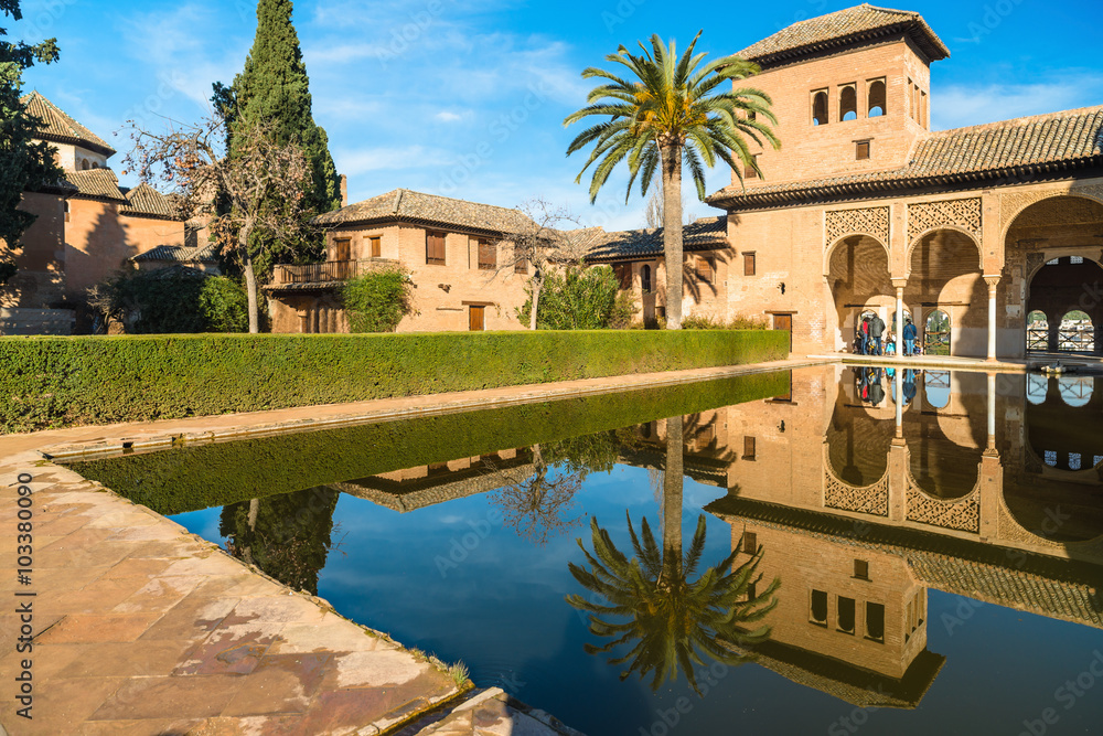 Partal Palace in La Alhambra Torre de las Damas and reflection in a ...