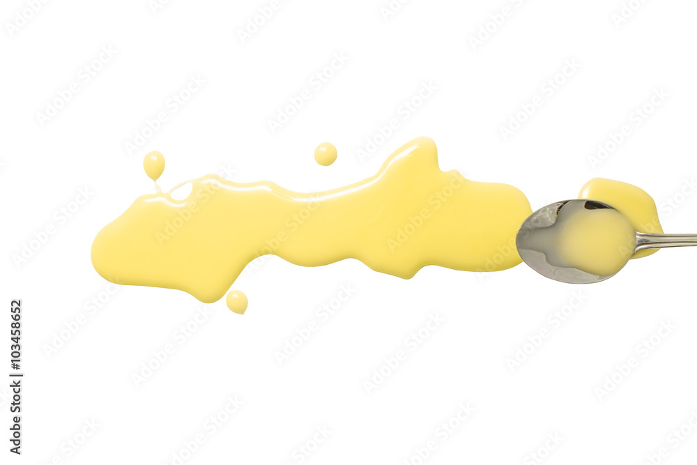 splashes and spilled condensed milk with a spoon. Blots of condensed ...