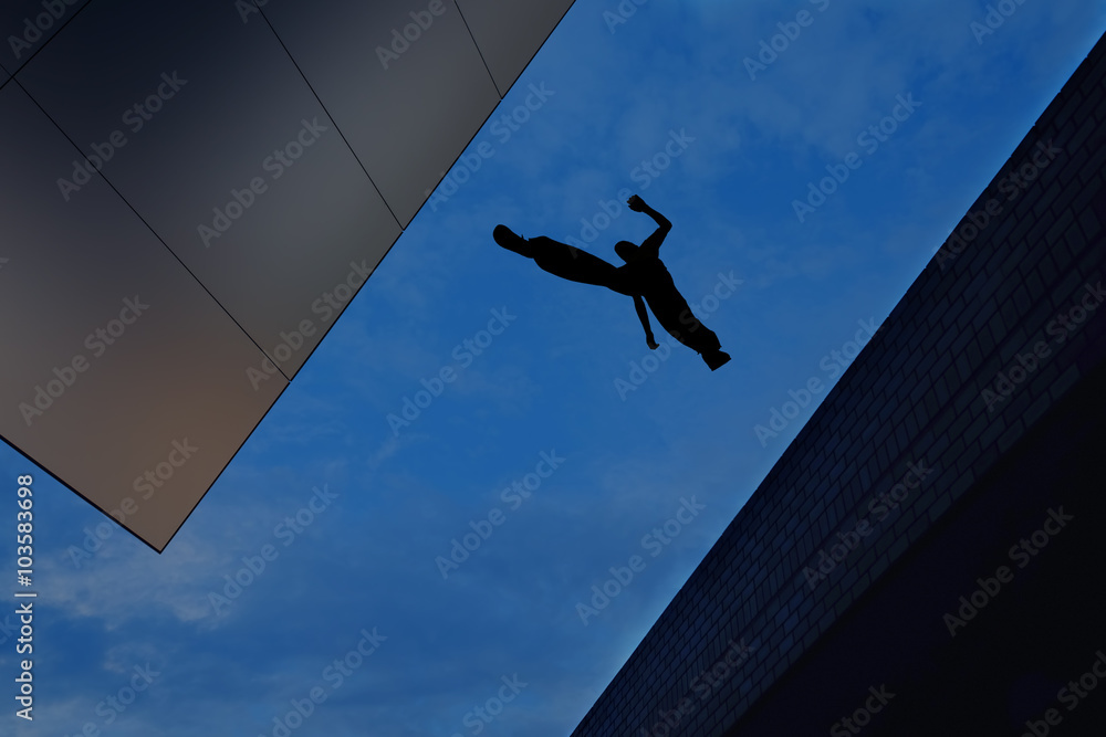 Man jumping over building roof against blue sky background Stock Photo | Adobe Stock