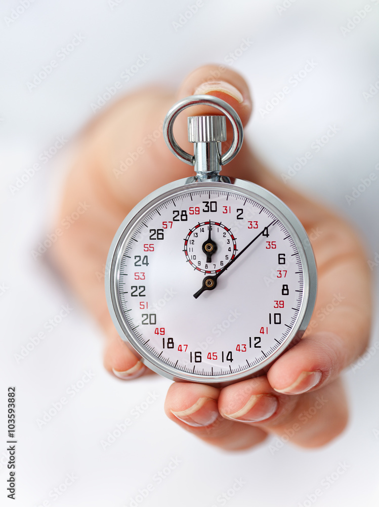 The clock is ticking - stopwatch in woman hand Stock Photo | Adobe Stock