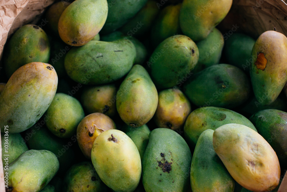 Raw mango in weaving basket Stock Photo | Adobe Stock