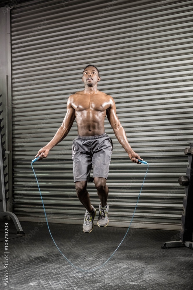 Shirtless man jumping the rope Stock Photo | Adobe Stock