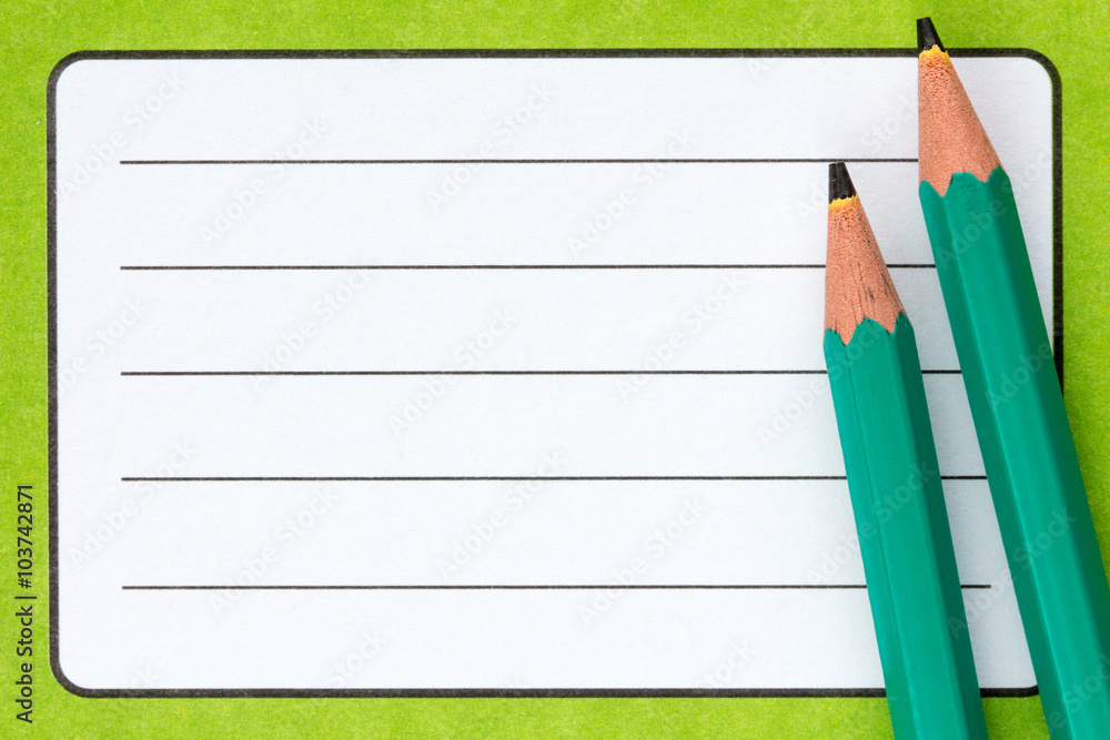 Exercise book name label and pencils Stock Photo | Adobe Stock