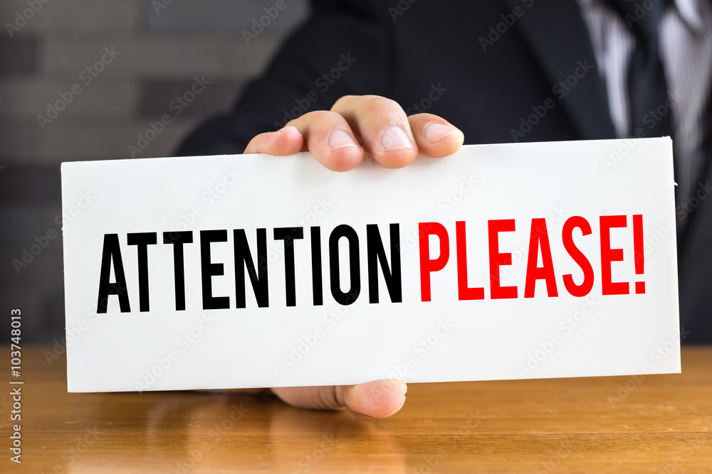 Attention please, message on white card and hold by businessman Stock ...