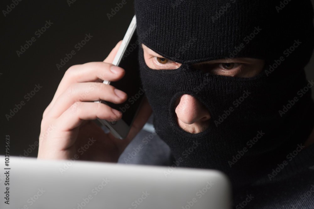 Hacker in a mask Stock Photo | Adobe Stock