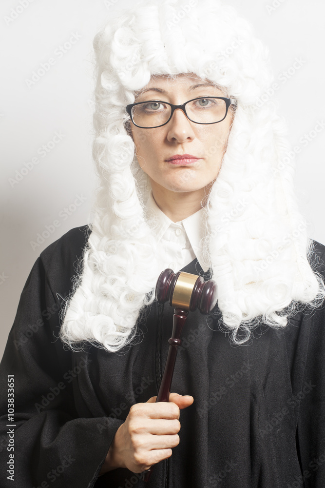 Female judge wearing a wig and Back mantle with eyeglasses holdi Stock ...