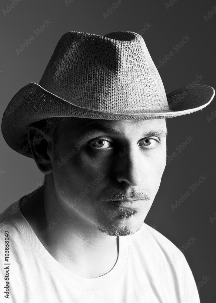 Man in a cowboy hat a weary expression on his face Stock Photo | Adobe ...