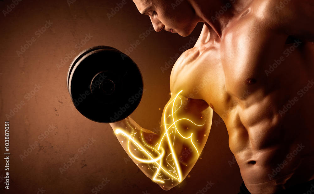 Muscular body builder lifting weight with energy lights on bicep Stock ...