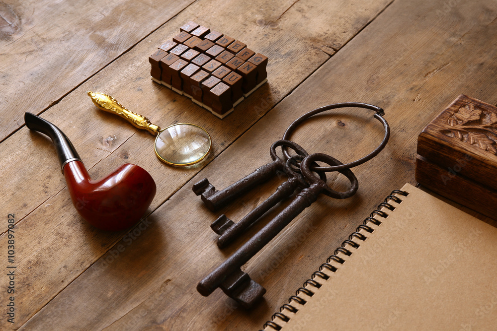 detective concept. Private Detective tools: magnifier glass, old keys ...