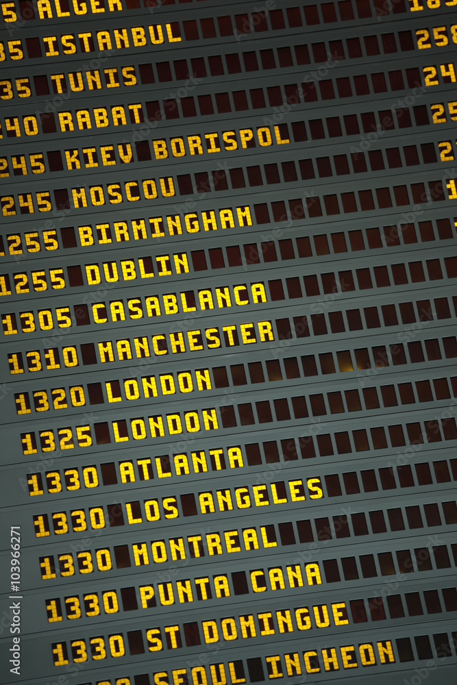 Airport arrivals and departures sign board display with destination ...