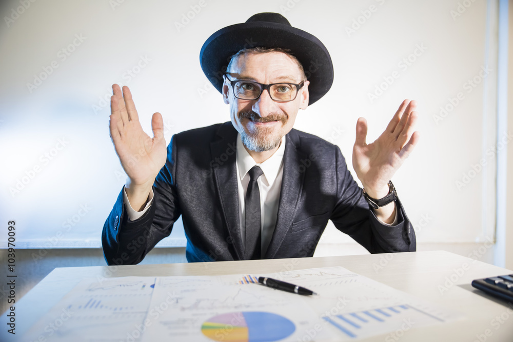 funny Jew businessman looking at the viewer at the camera smiles and ...