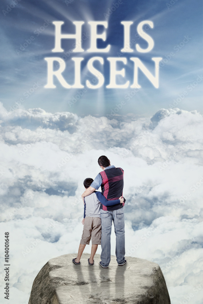 Father with his son looking at text he is risen Stock Photo | Adobe Stock