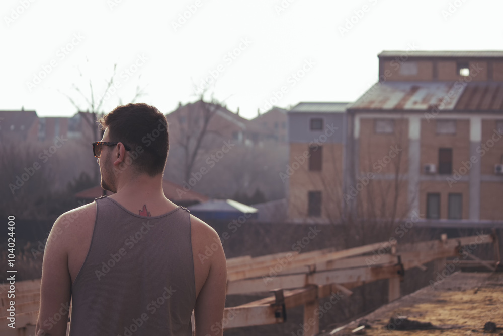 Back shot of a man looking into the distance Stock Photo | Adobe Stock