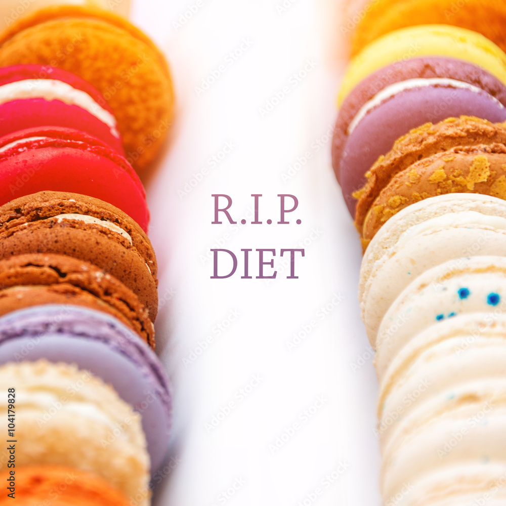 Traditional french colorful macaroons in a rows in a box with words RIP ...