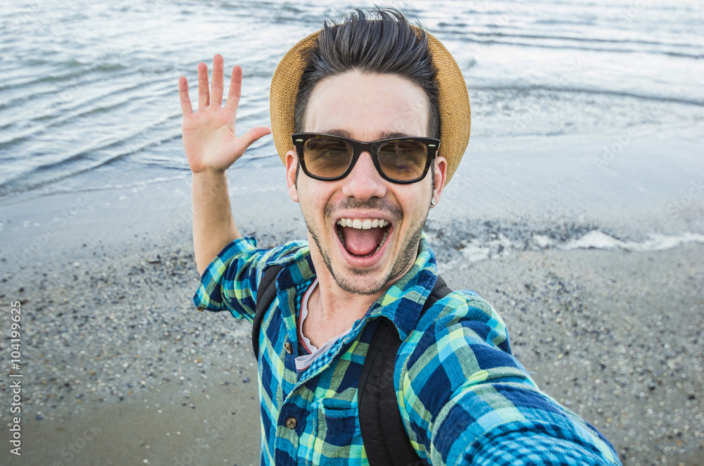 Handsome caucasian man take a selfie at the beach - people, lifestyle ...