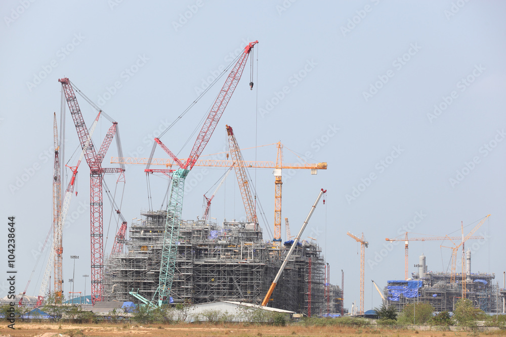 Chemical plant under construction with big crane Stock Photo | Adobe Stock