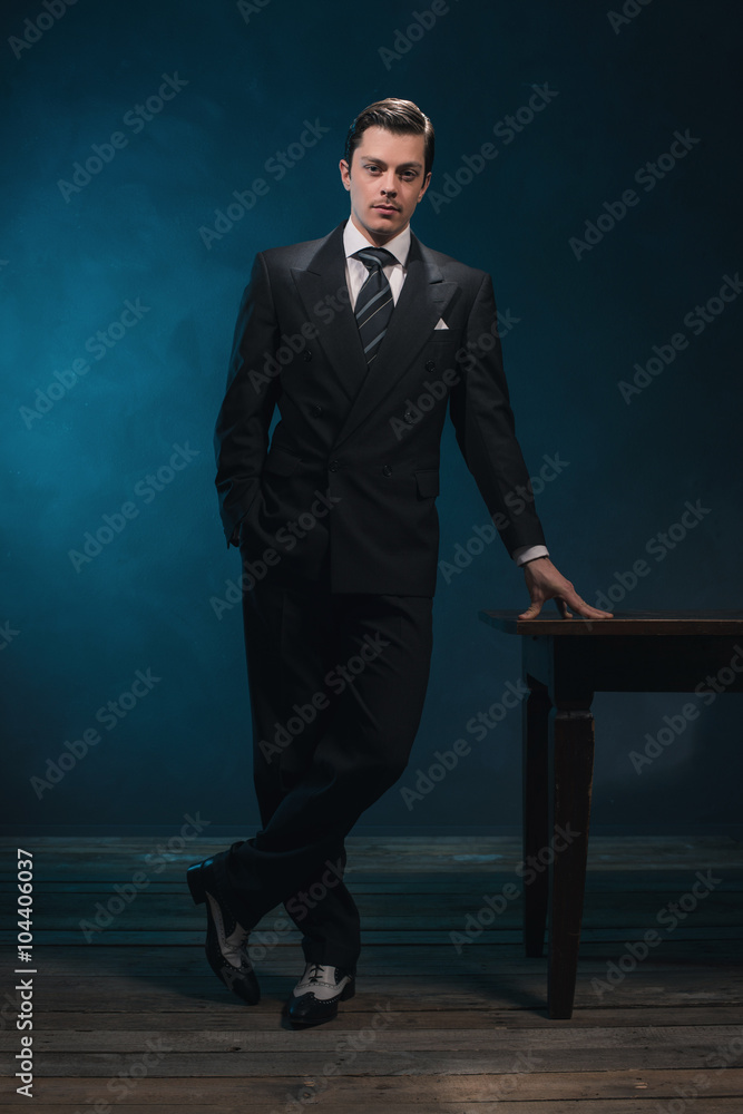Retro 1940s business man in suit and tie standing next to empty Stock ...