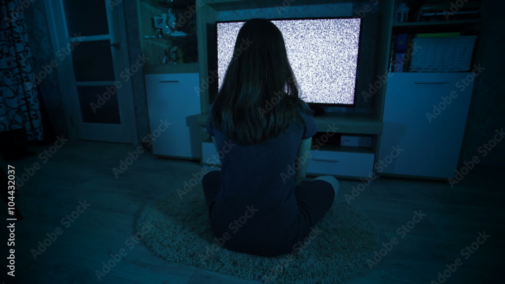 Creepy girl waching TV with grain Stock Video | Adobe Stock