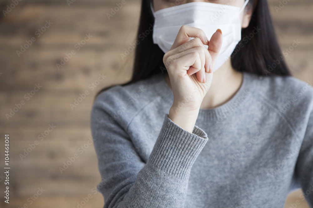 Woman wearing a mask has a cough Stock Photo | Adobe Stock