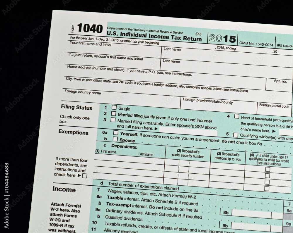 Blank 2015 Individual 1040 US Tax return form on black background Stock ...
