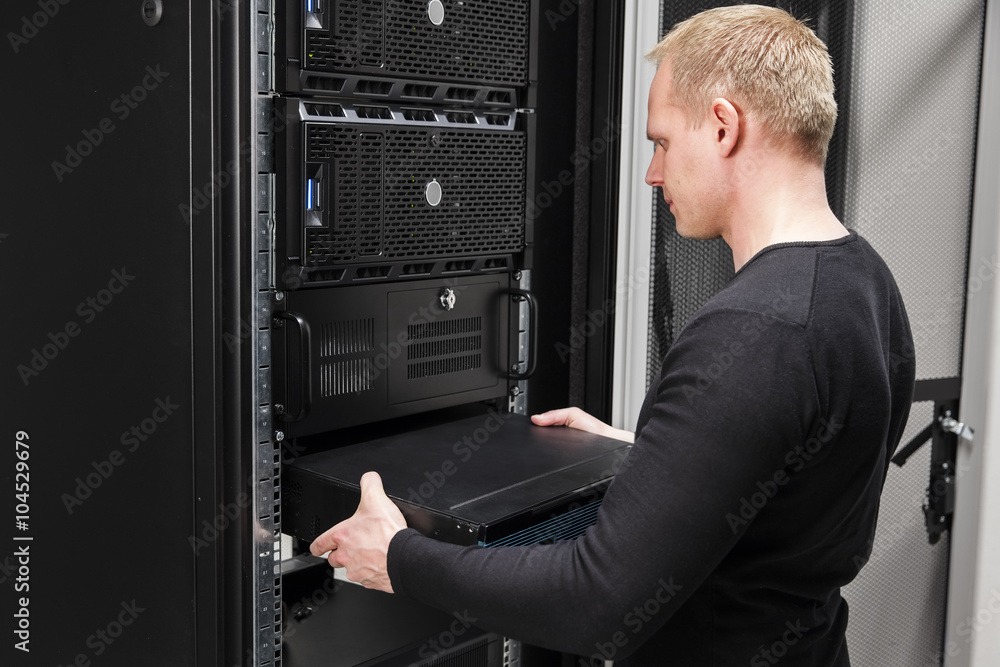 It consultant install network router in datacenter Stock Photo | Adobe ...