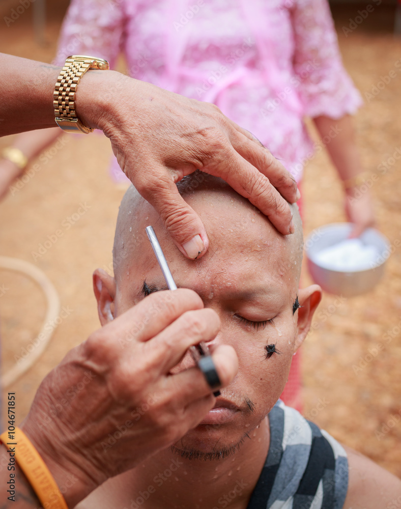 Male who will be monk cut hair for be Ordained. Stock Photo | Adobe Stock
