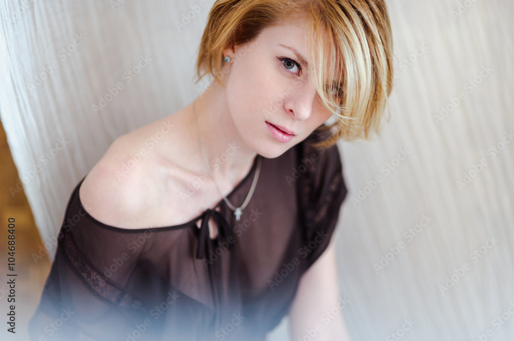 Lovely blonde on a bed in a negligee Stock Photo | Adobe Stock