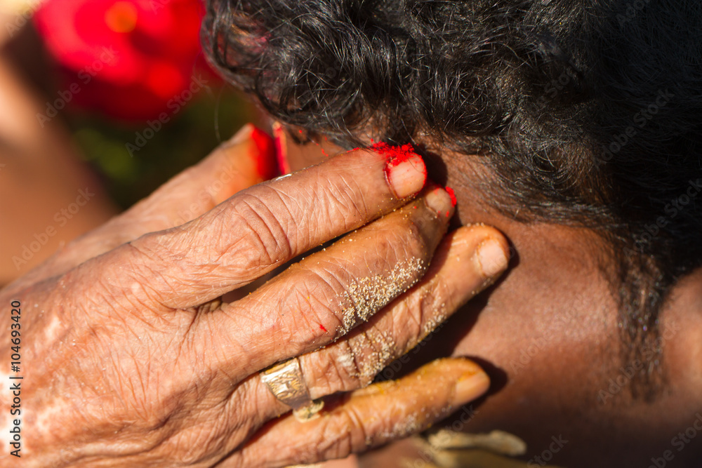 Bindi, the third eye.The priest draws bindi Stock Photo | Adobe Stock