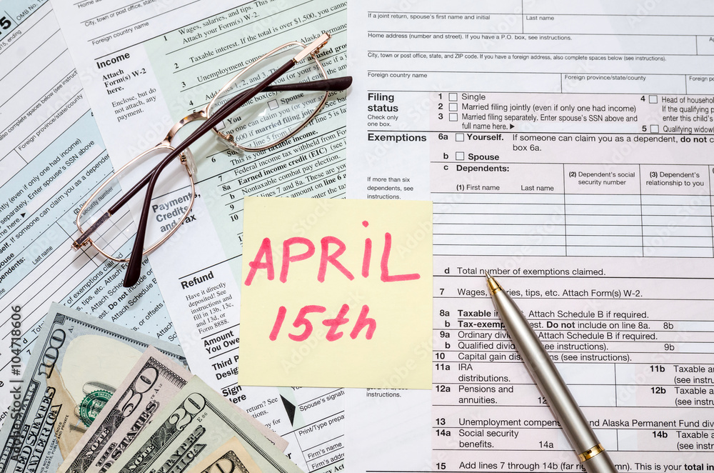 Official USA tax form 1040, calculator, pen and dollar and the day tax ...