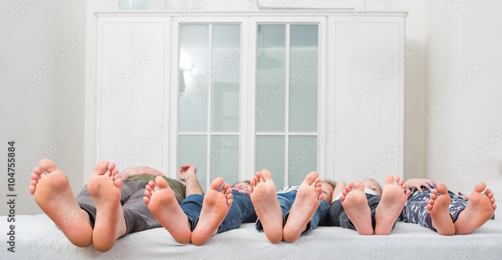 Feet of a family in bed Stock Photo | Adobe Stock